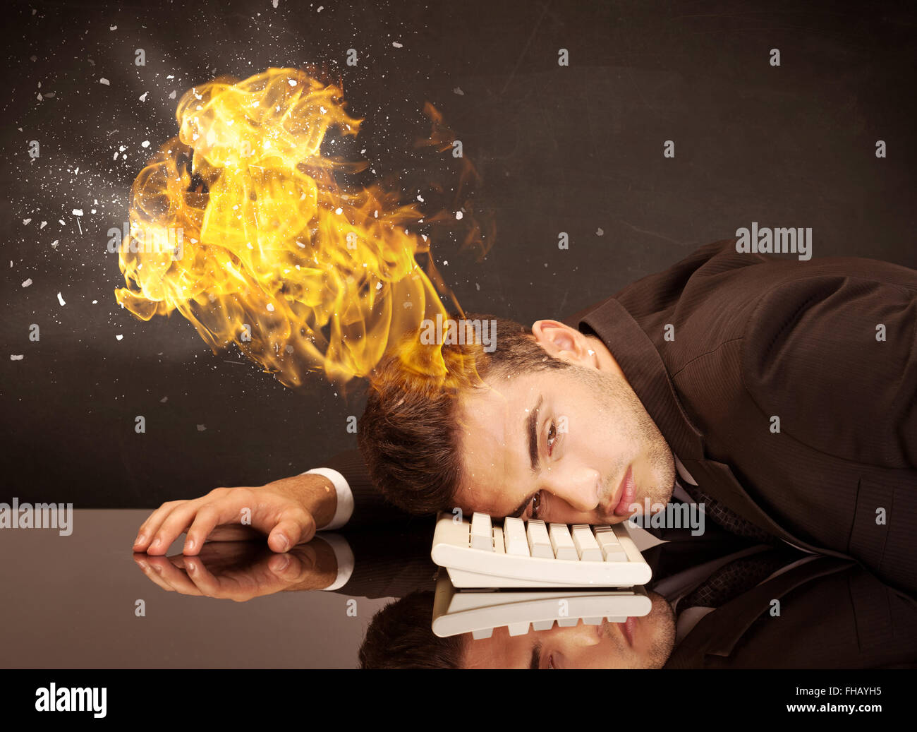 Stressed business man's head is burning Stock Photo - Alamy