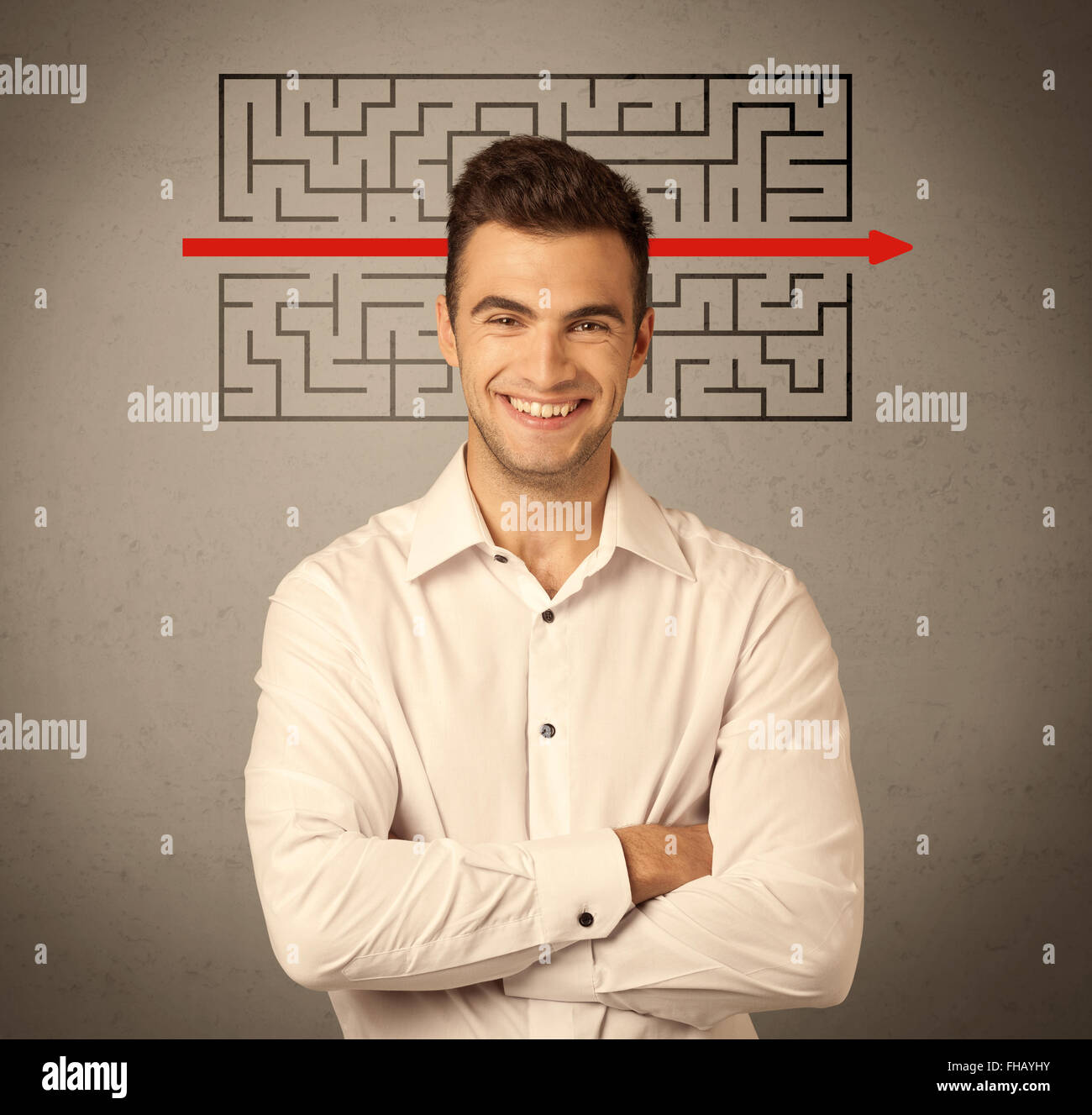 Handsome business guy solving maze Stock Photo - Alamy
