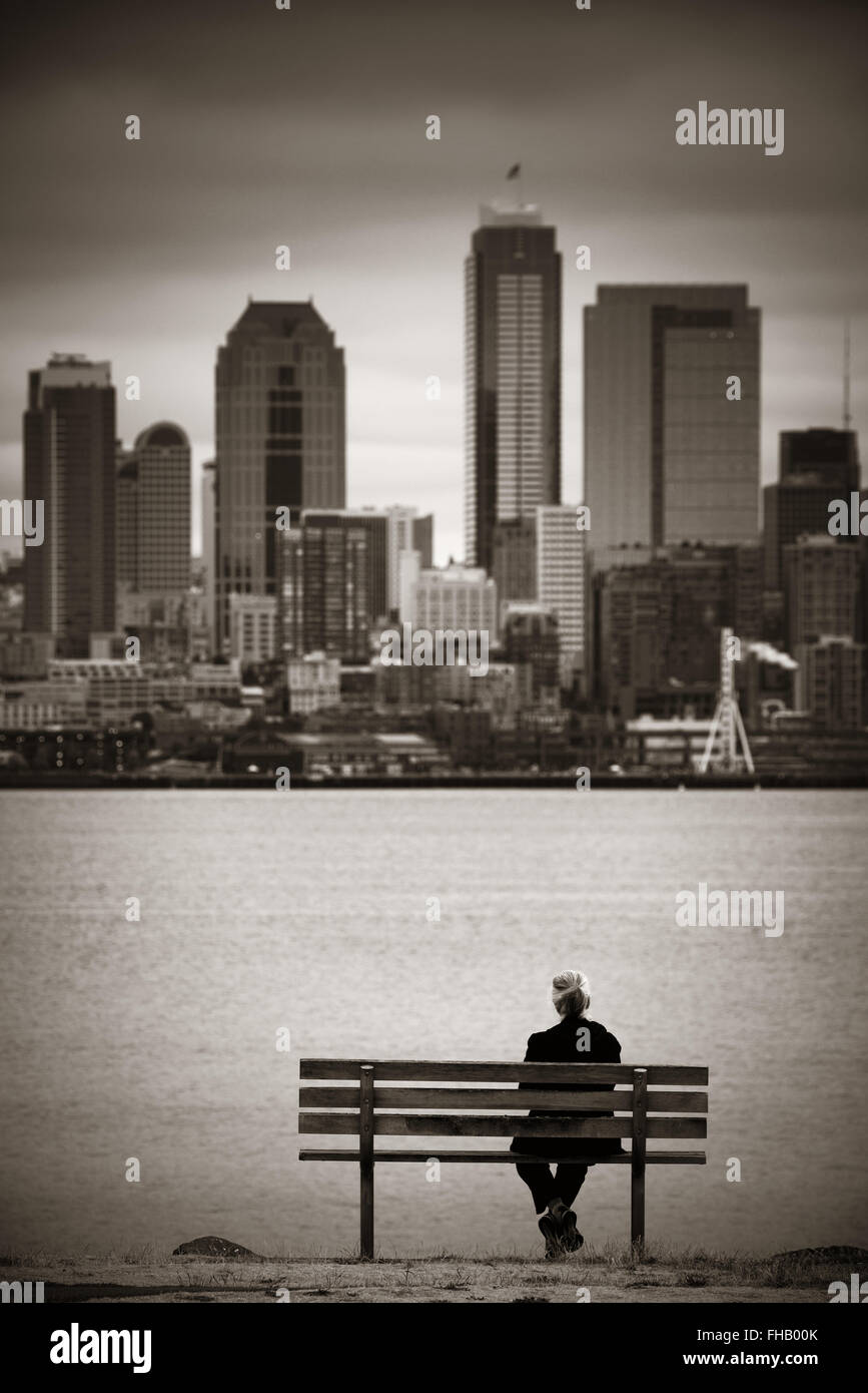 A lady rest at waterfront with Seattle city skyline Stock Photo - Alamy