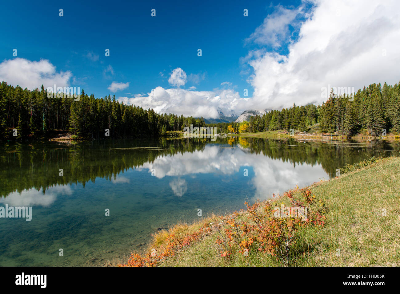 Johnson Lake, Mount Rundle behind clouds, Banff National Park, canadian ...