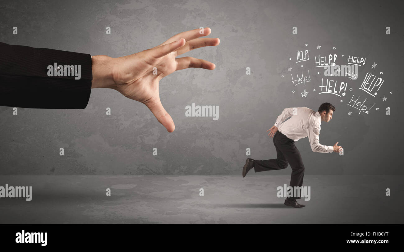 Business person running away from big hand Stock Photo - Alamy