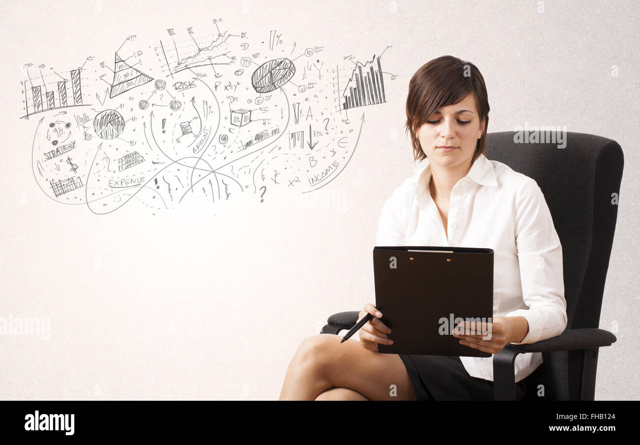 Pretty girl sketching graphs and diagrams on wall Stock Photo - Alamy