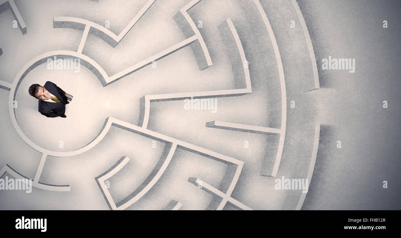 Business man trapped in a circular maze Stock Photo - Alamy