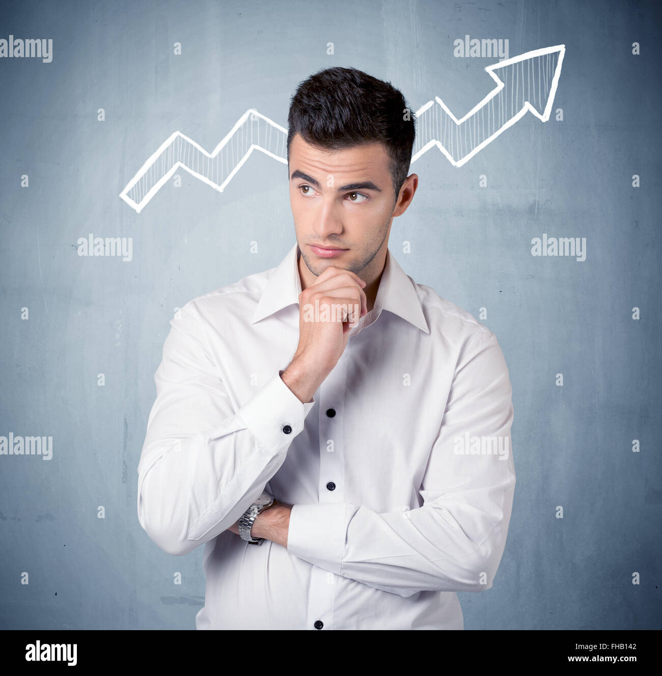 Smiling business guy with graph arrow Stock Photo - Alamy
