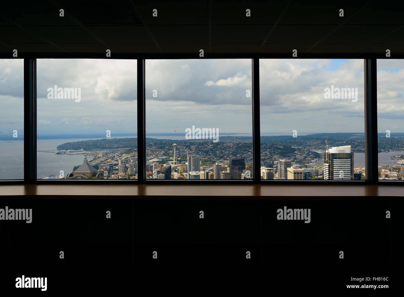 Seattle rooftop panorama view with urban architecture through window ...