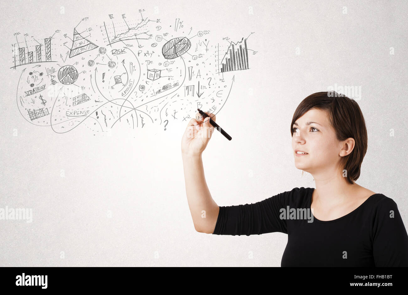 Pretty girl sketching graphs and diagrams on wall Stock Photo - Alamy