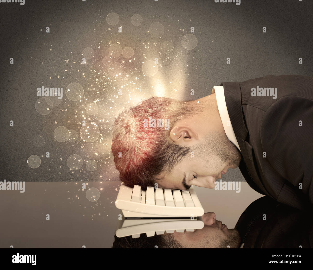 Angry businessman with lights and keyboard Stock Photo - Alamy