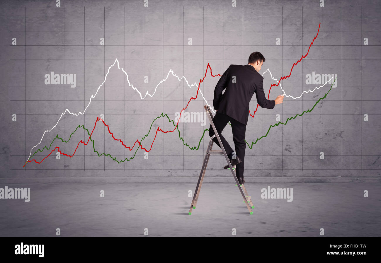 male on ladder drawing chart lines Stock Photo - Alamy