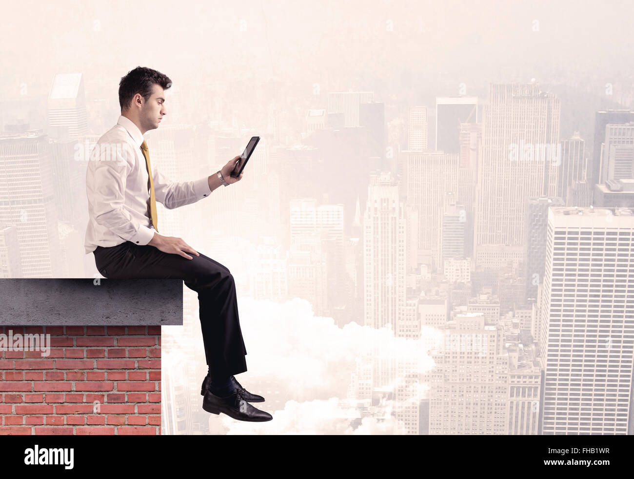 Office worker sitting on rooftop in city Stock Photo - Alamy