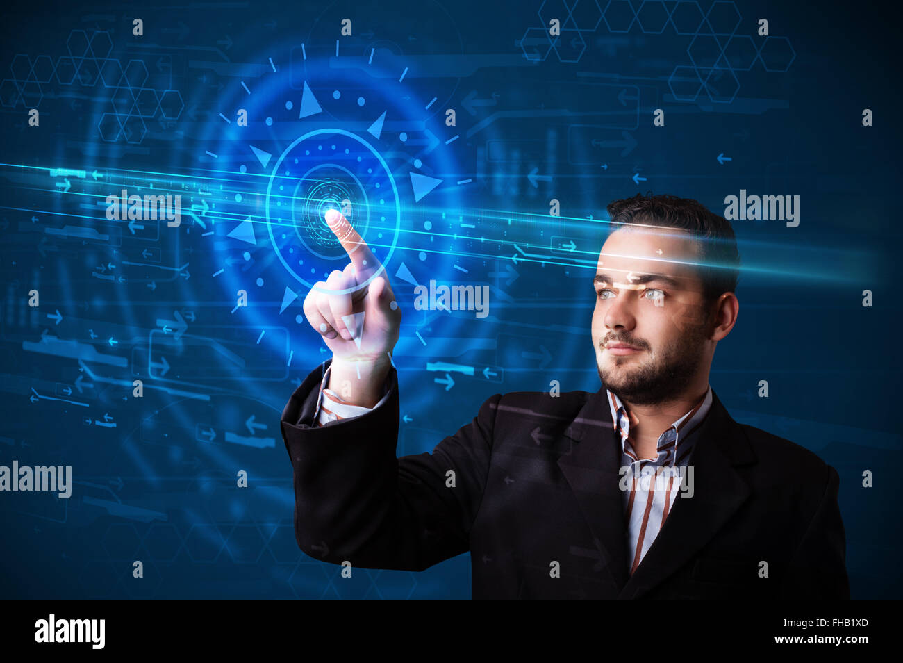 Handsome tech guy pressing high technology control panel screen concept ...