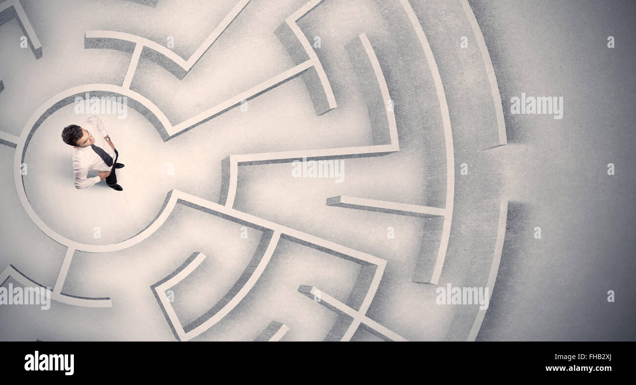 Business man trapped in a circular maze Stock Photo - Alamy