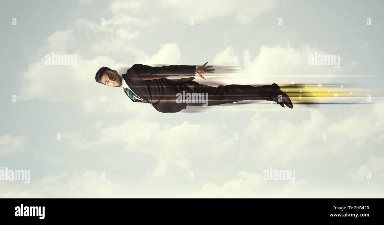 Happy business man flying fast on the sky between clouds Stock Photo ...