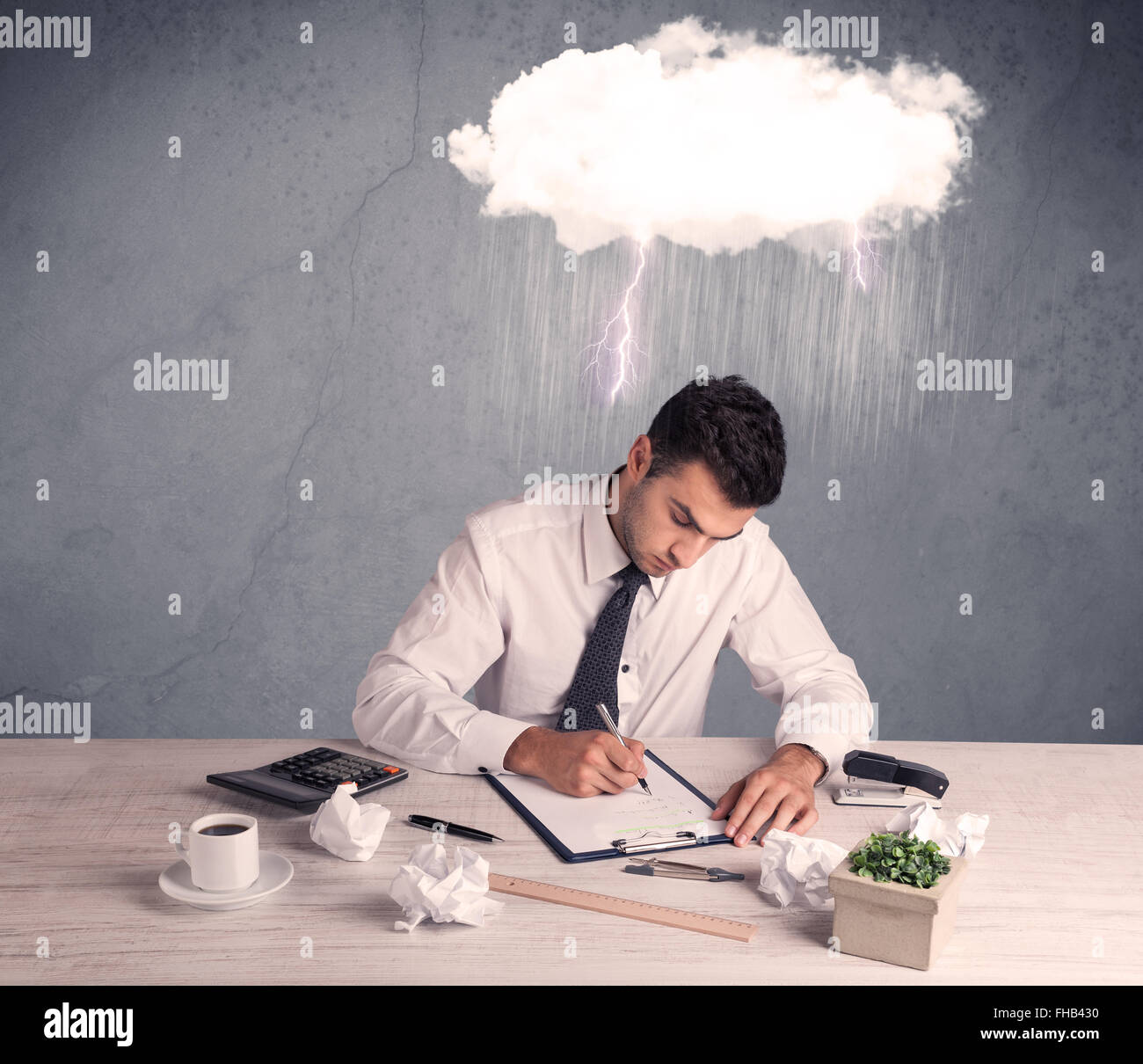 Stressed out businessman at office desk Stock Photo - Alamy
