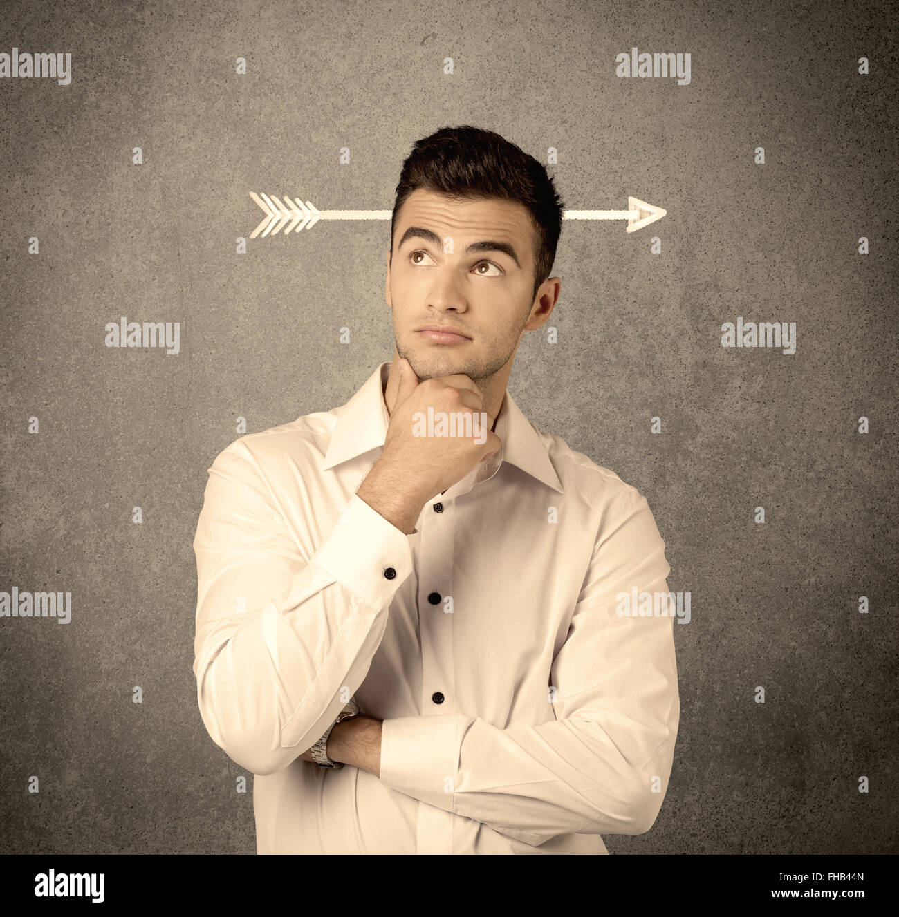 Young sales guy with arrow in the head Stock Photo - Alamy