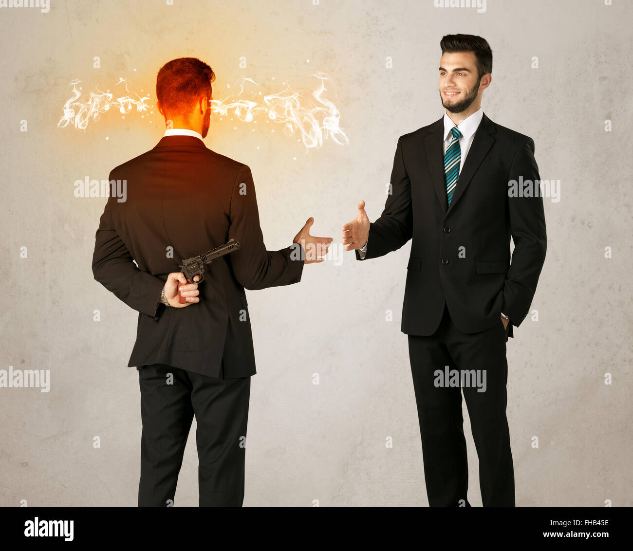 Angry businessman with weapon Stock Photo - Alamy