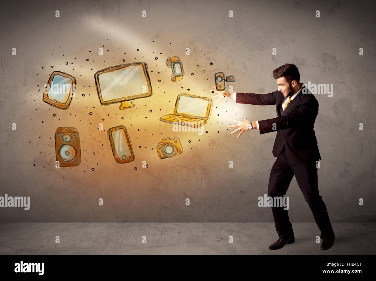 Man throwing hand drawn electronical devices Stock Photo - Alamy