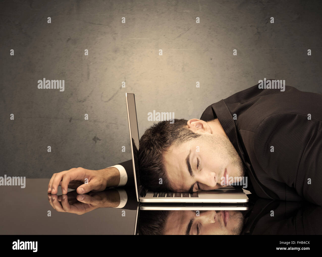 Frustrated businessman's head on keyboard Stock Photo - Alamy