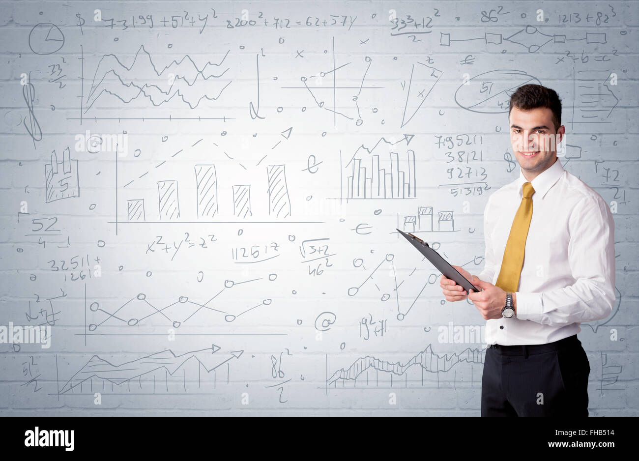 Salesman standing with drawn graph charts Stock Photo - Alamy