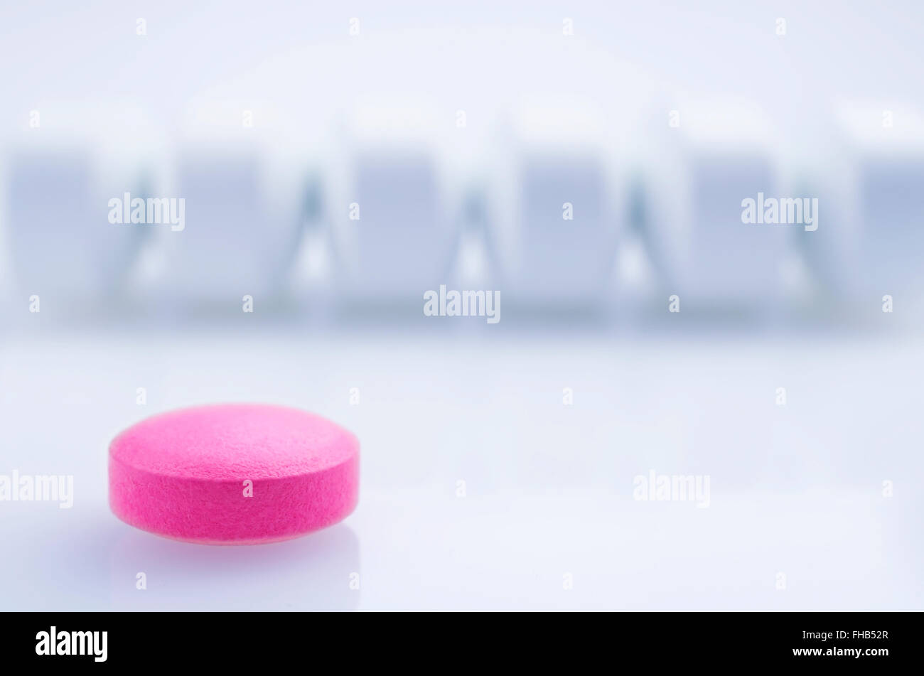 Medicine pink pill Stock Photo - Alamy