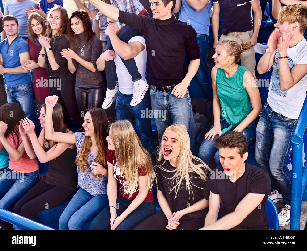 Sport fans clapping and singing on tribunes Stock Photo - Alamy