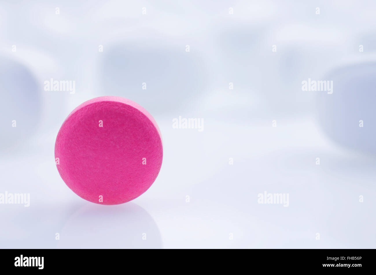 Medicine pink pill Stock Photo - Alamy