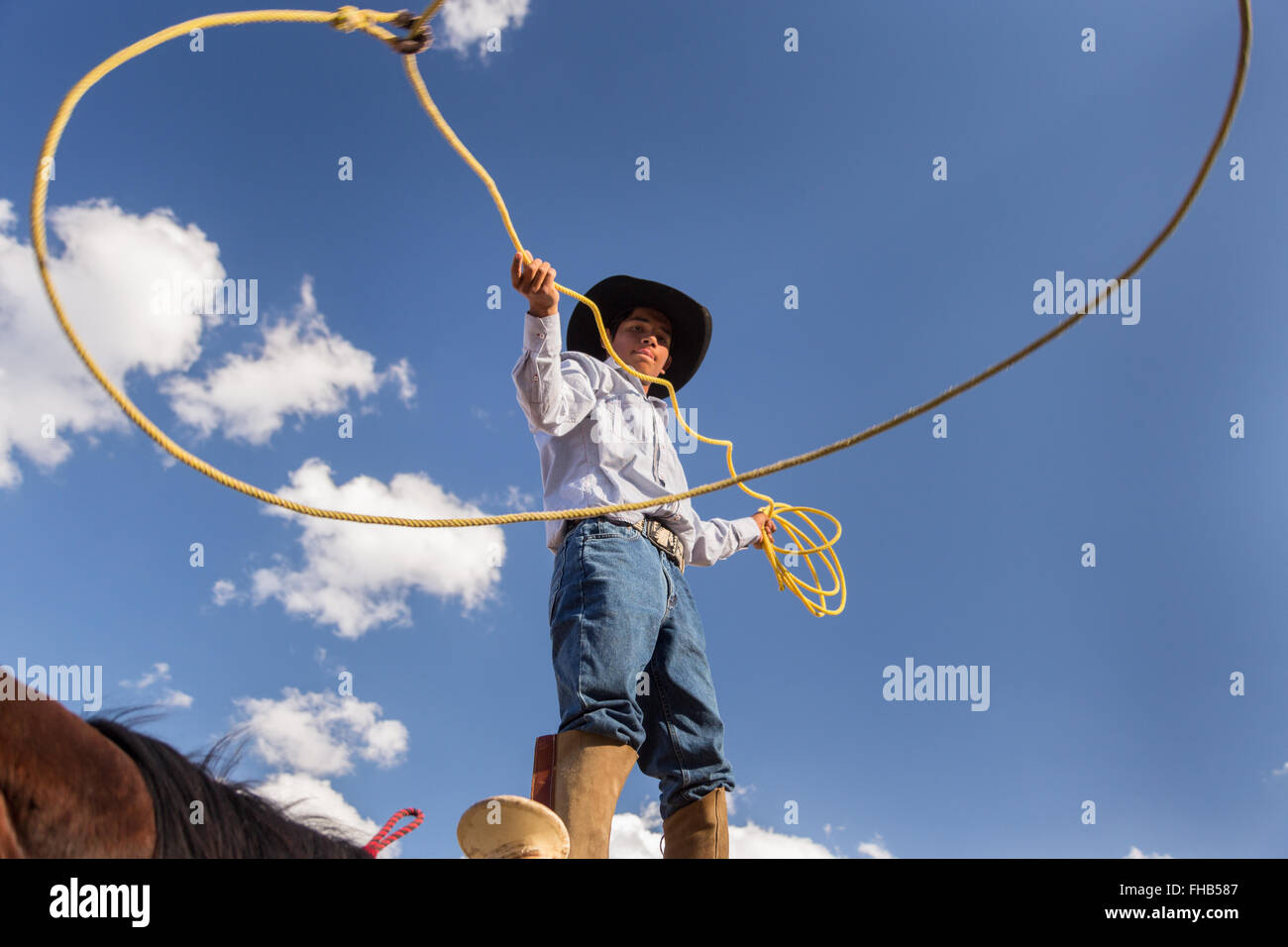 A Mexican charro or cowboy practices roping skills on his horse before ...