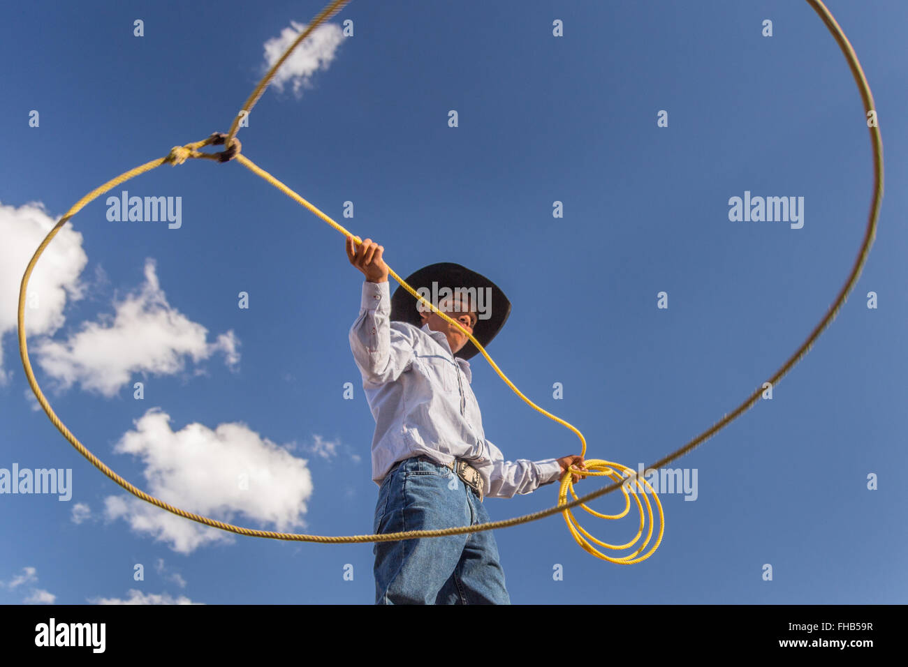 A Mexican charro or cowboy practices roping skills on his horse before ...