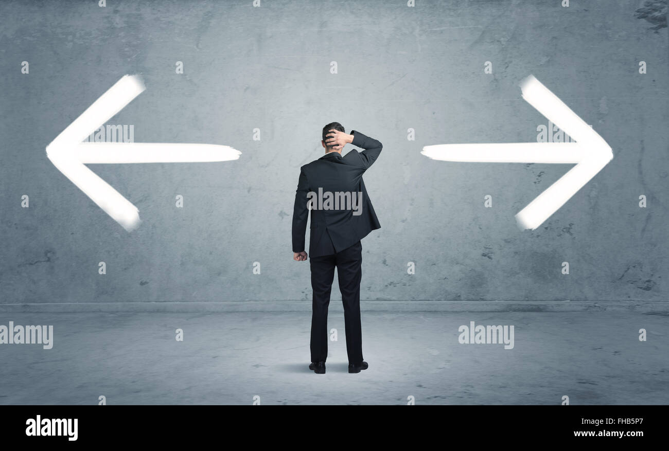 Confused business person choosing the way Stock Photo - Alamy