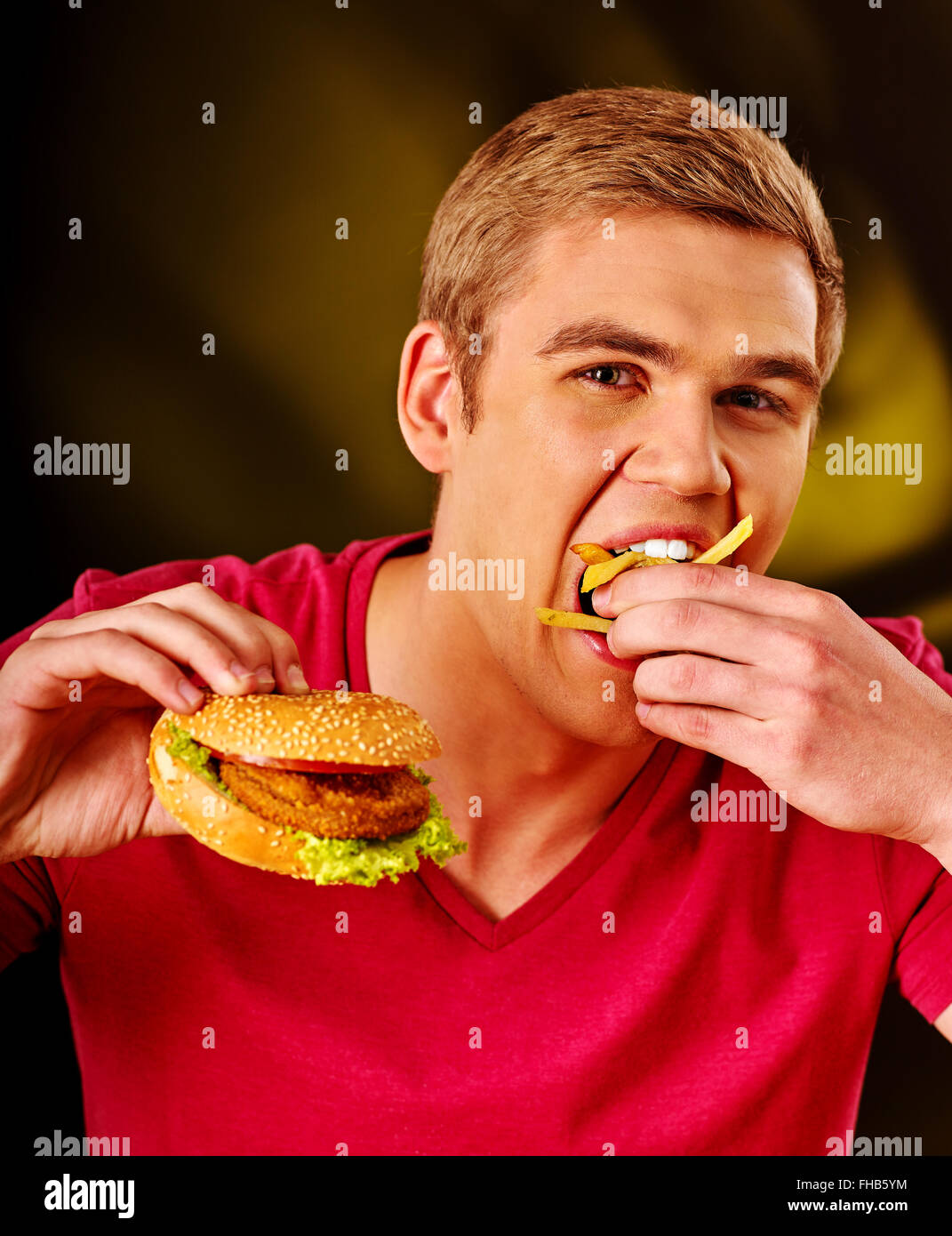 Man eating big sandwich Stock Photo - Alamy