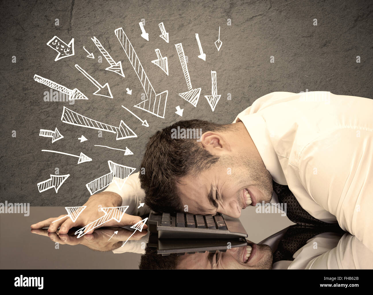 Arrows pointing at sad office worker Stock Photo - Alamy