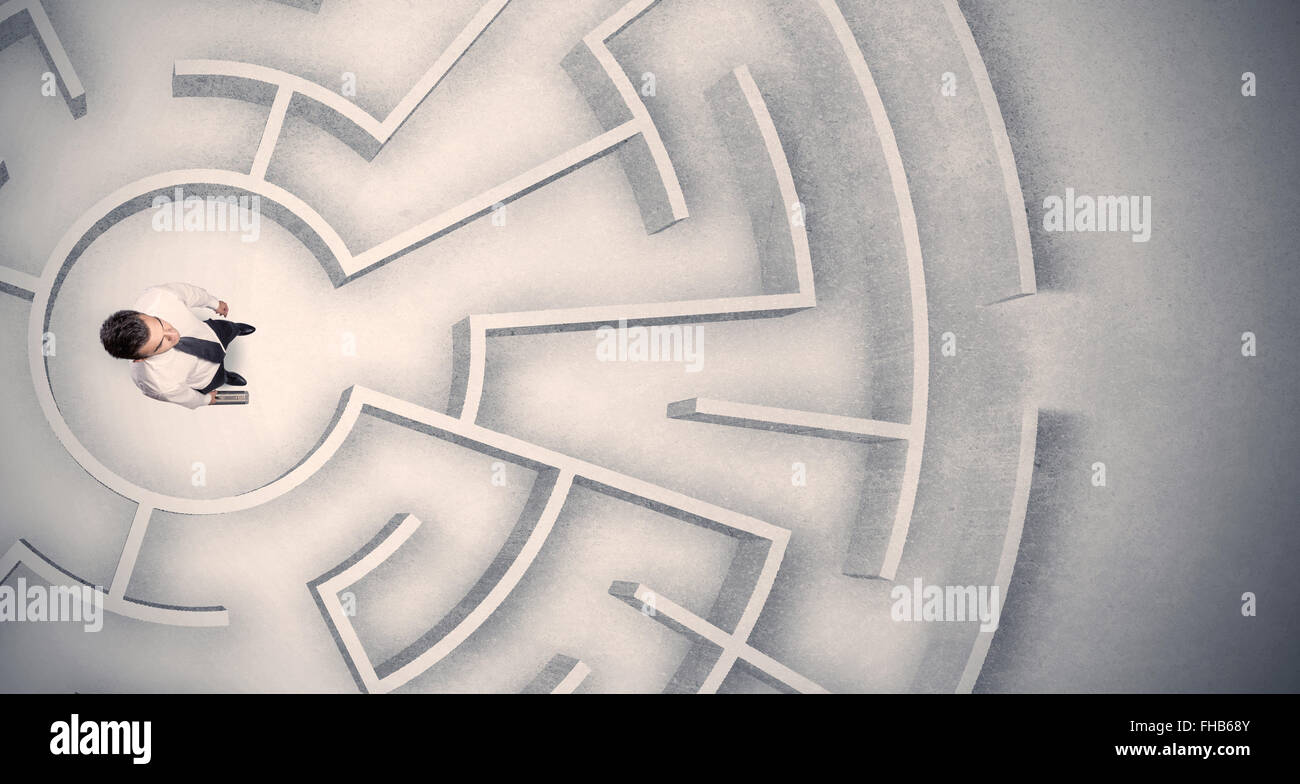 Business man trapped in a circular maze Stock Photo - Alamy