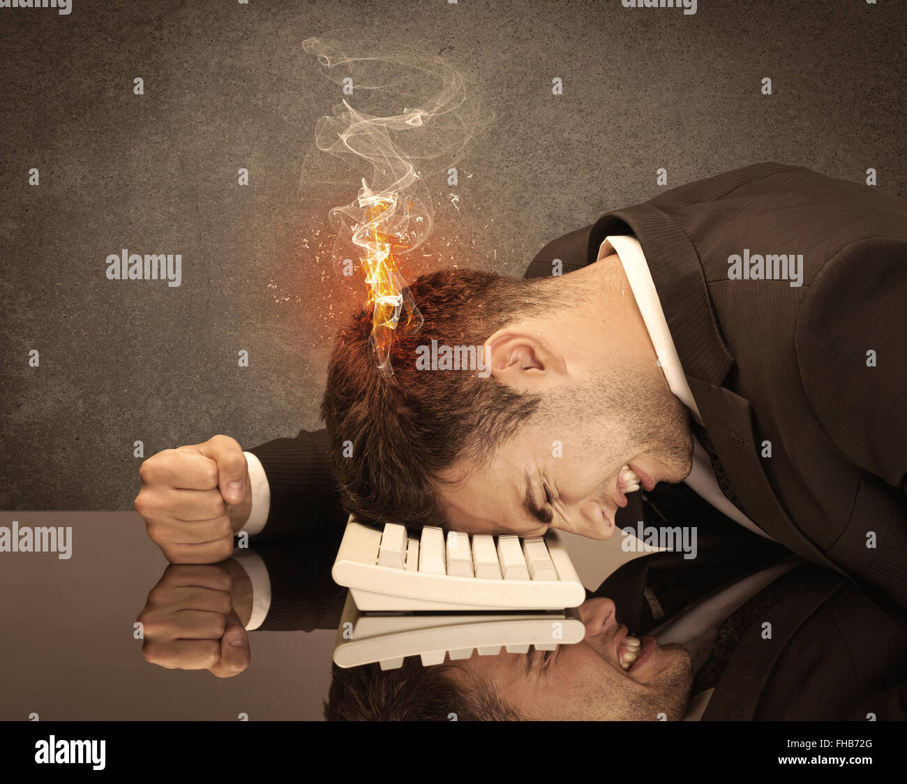 Sad business person's head catching fire Stock Photo - Alamy