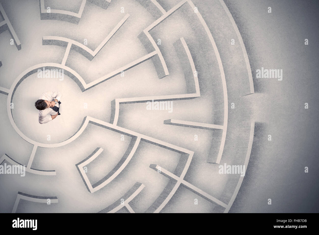 Business man trapped in a circular maze Stock Photo - Alamy
