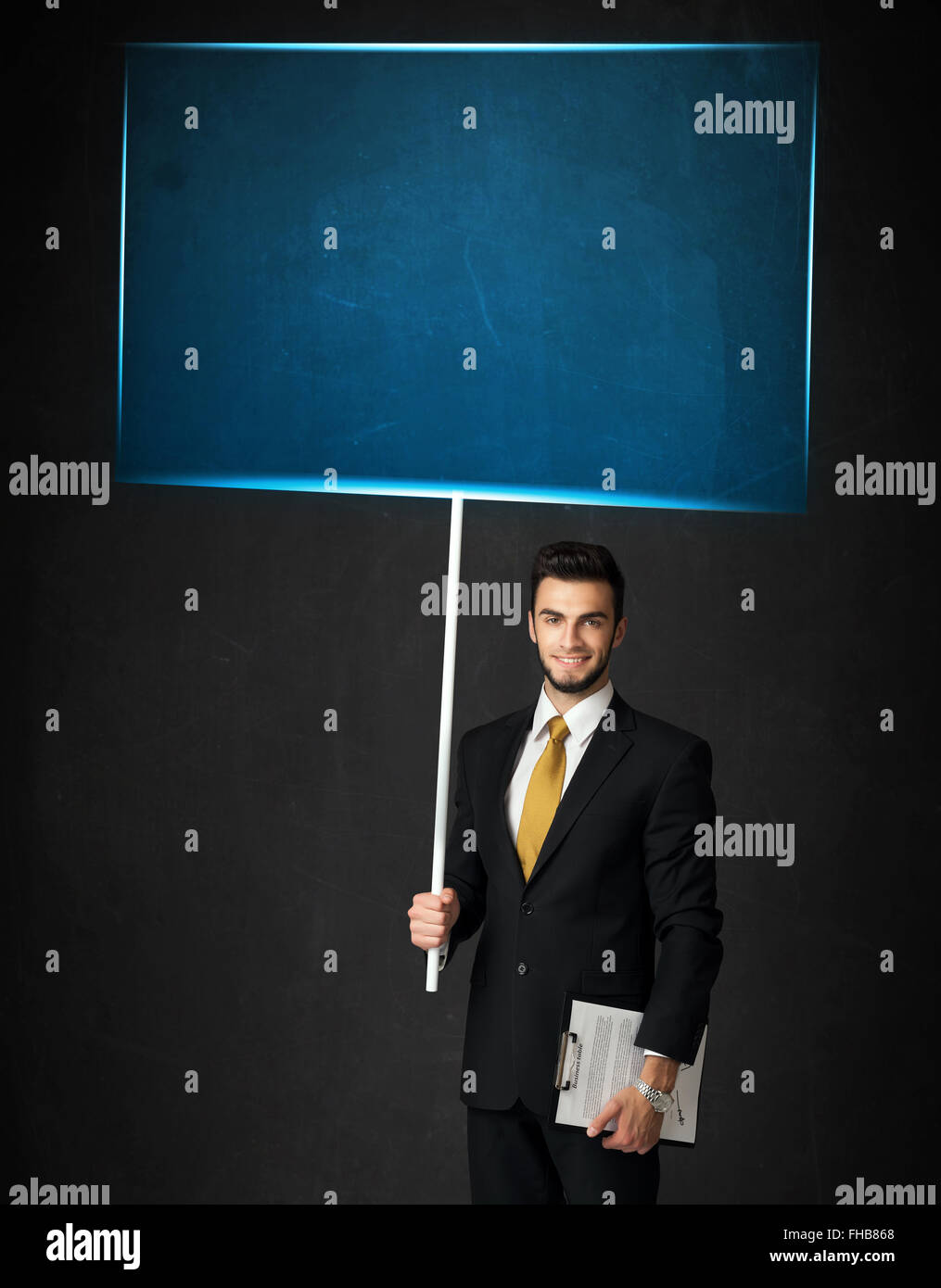 Businessman with blue board Stock Photo - Alamy