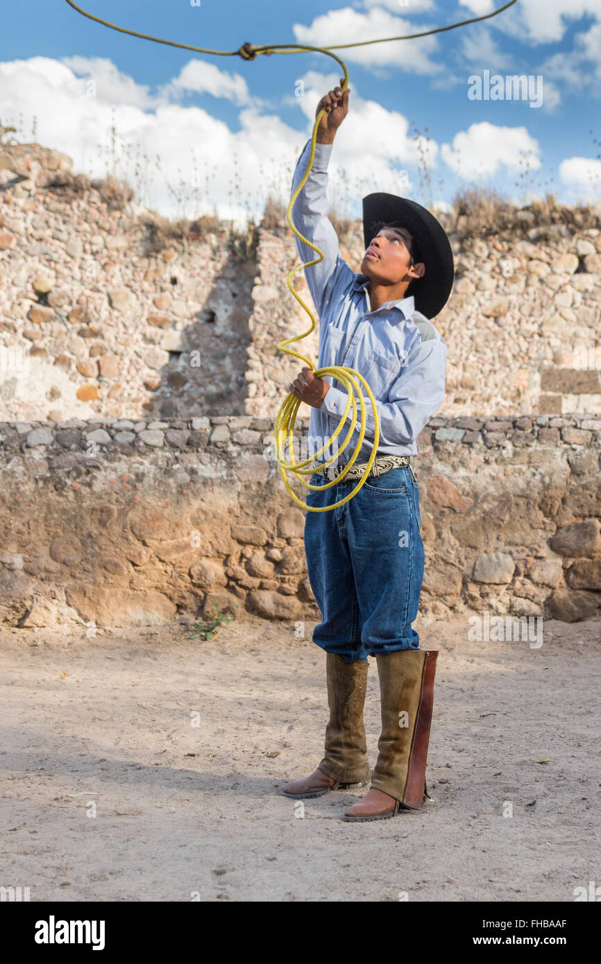 A Mexican charro or cowboy practices roping skills at a hacienda ranch ...