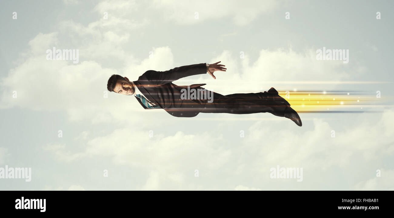 Happy business man flying fast on the sky between clouds Stock Photo ...