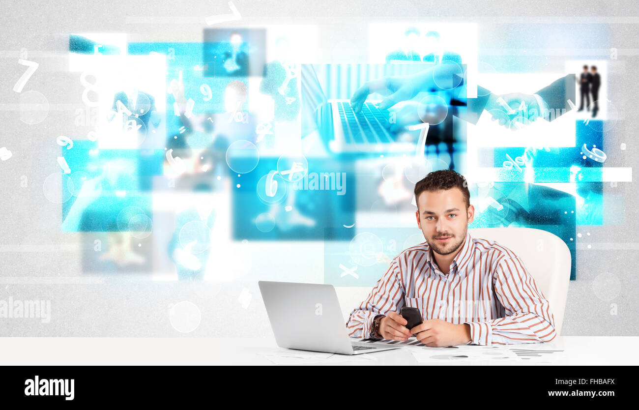 Business person at desk with modern tech images at background Stock ...
