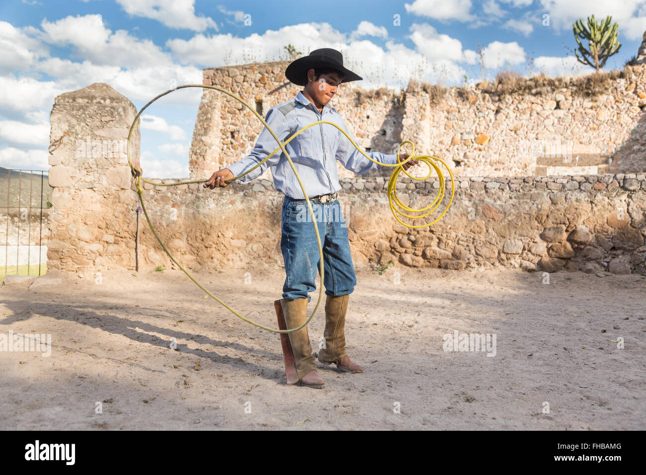 A Mexican charro or cowboy practices roping skills at a hacienda ranch ...
