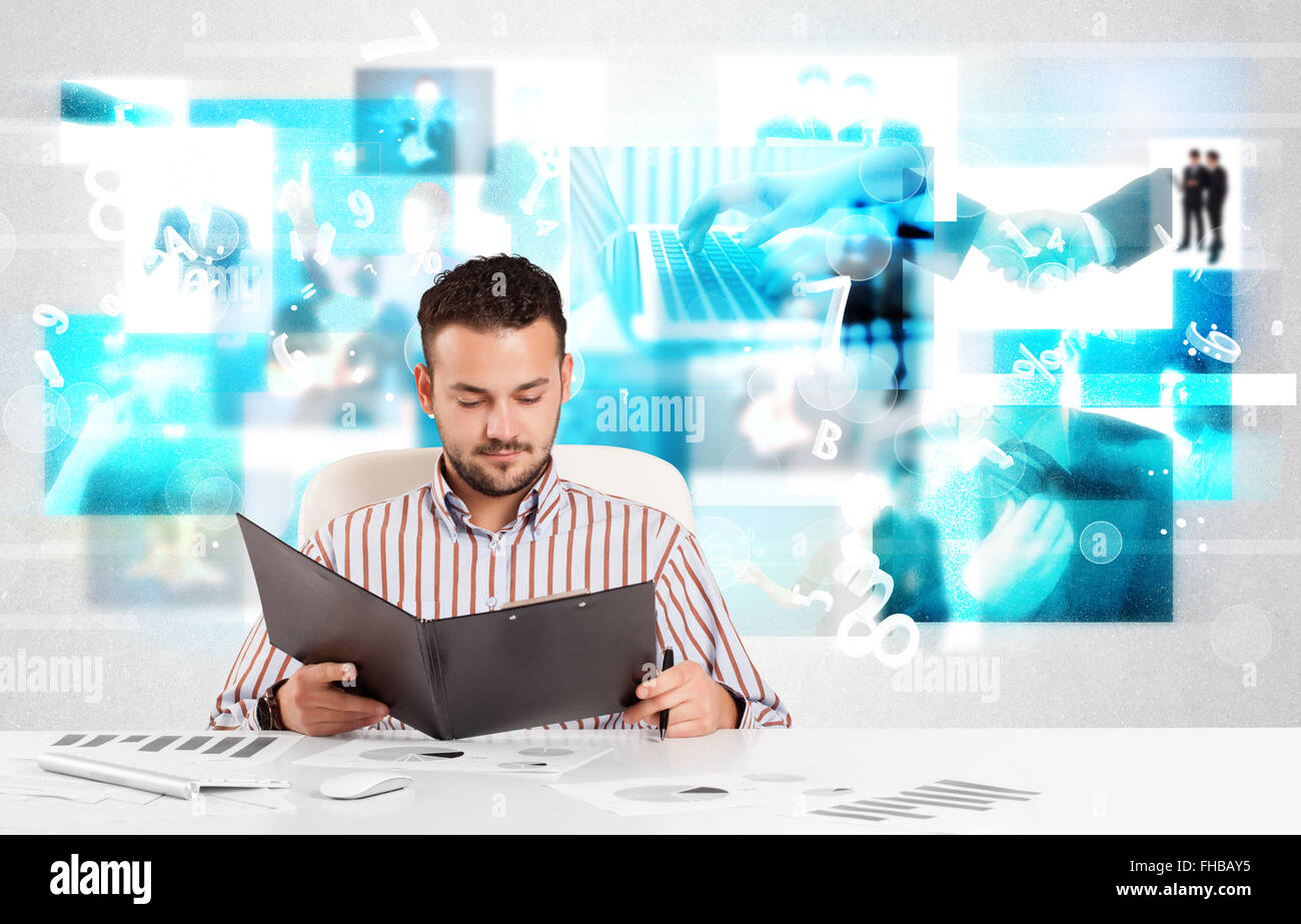 Business person at desk with modern tech images at background Stock ...