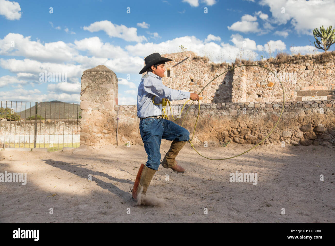 A Mexican charro or cowboy practices roping skills at a hacienda ranch ...