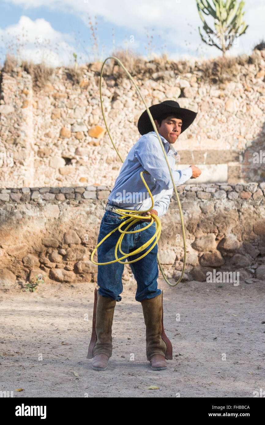 A Mexican charro or cowboy practices roping skills at a hacienda ranch ...