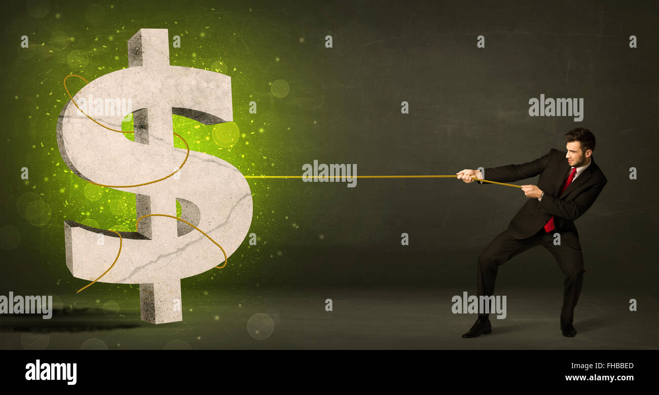 Business man pulling a big green dollar sign Stock Photo - Alamy