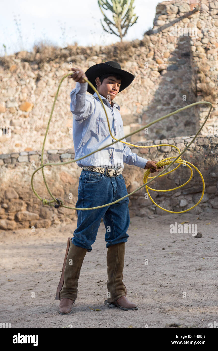 A Mexican charro or cowboy practices roping skills at a hacienda ranch ...