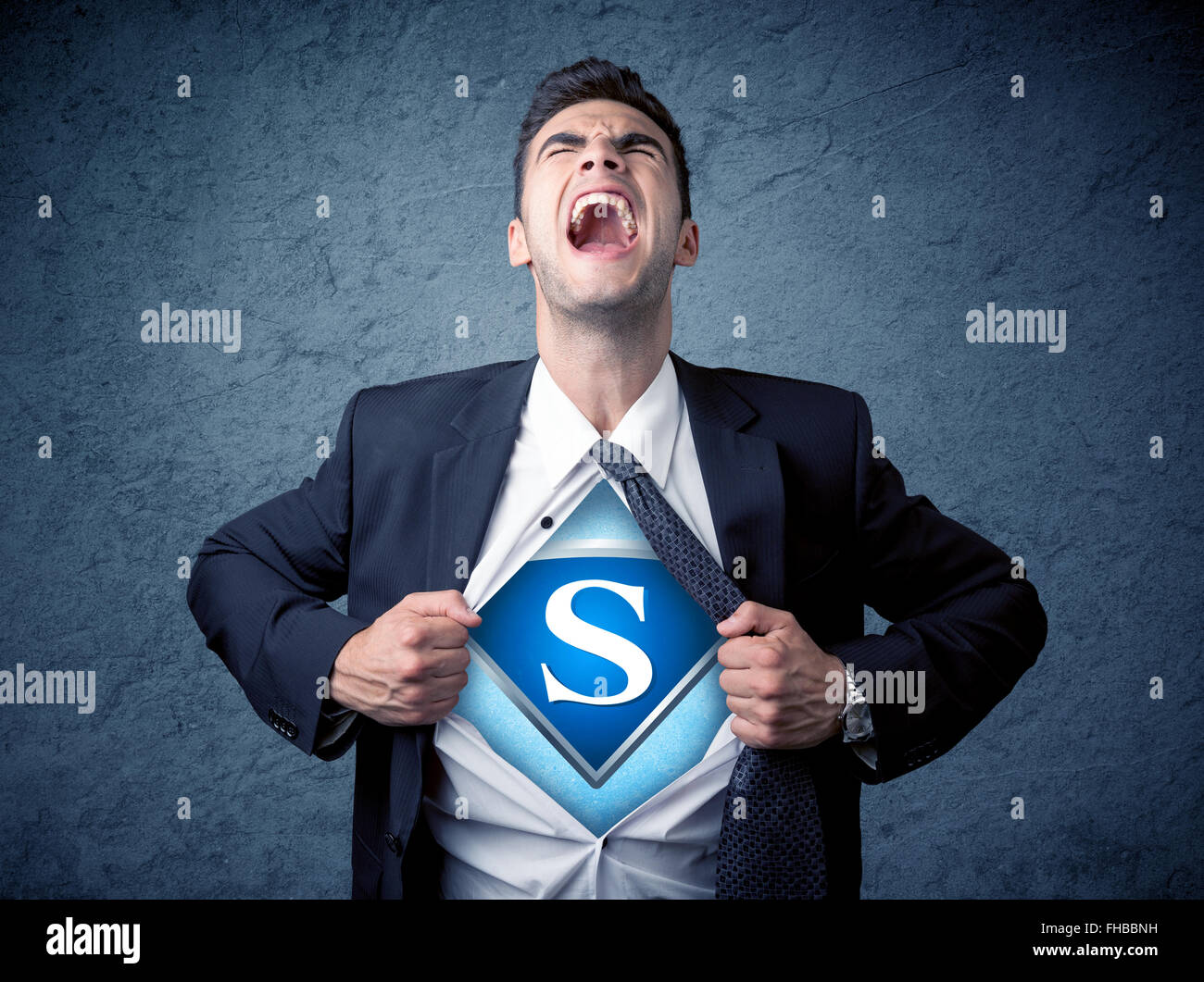 Businessman ripping off his shirt with superhero sign Stock Photo - Alamy