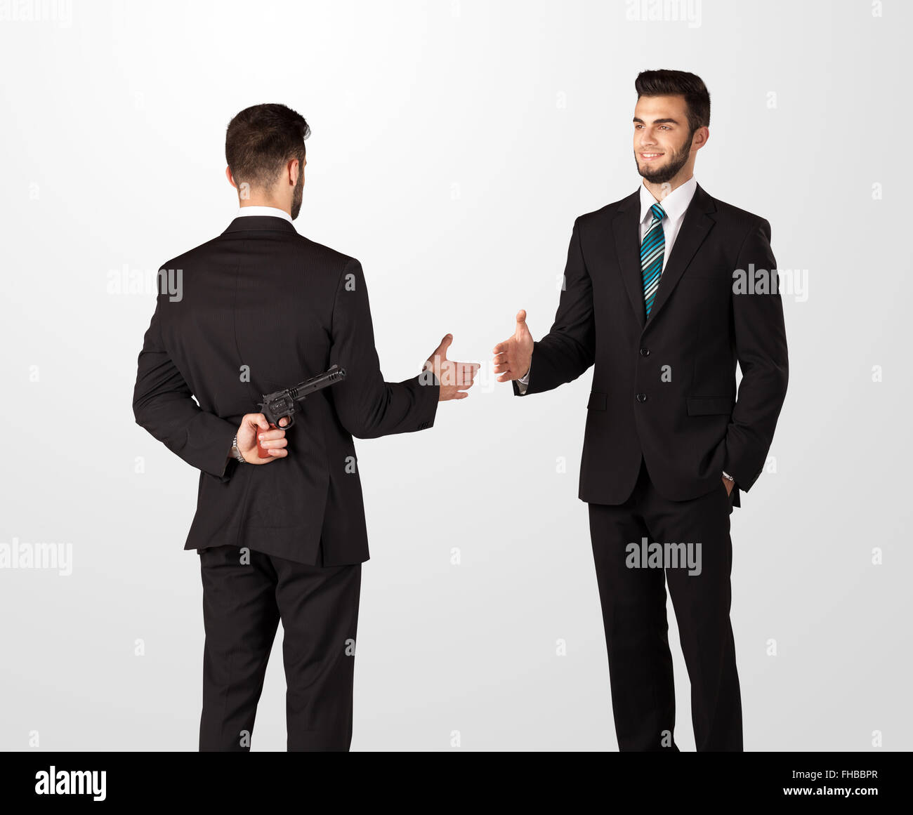 Two businessman shake hands Stock Photo - Alamy