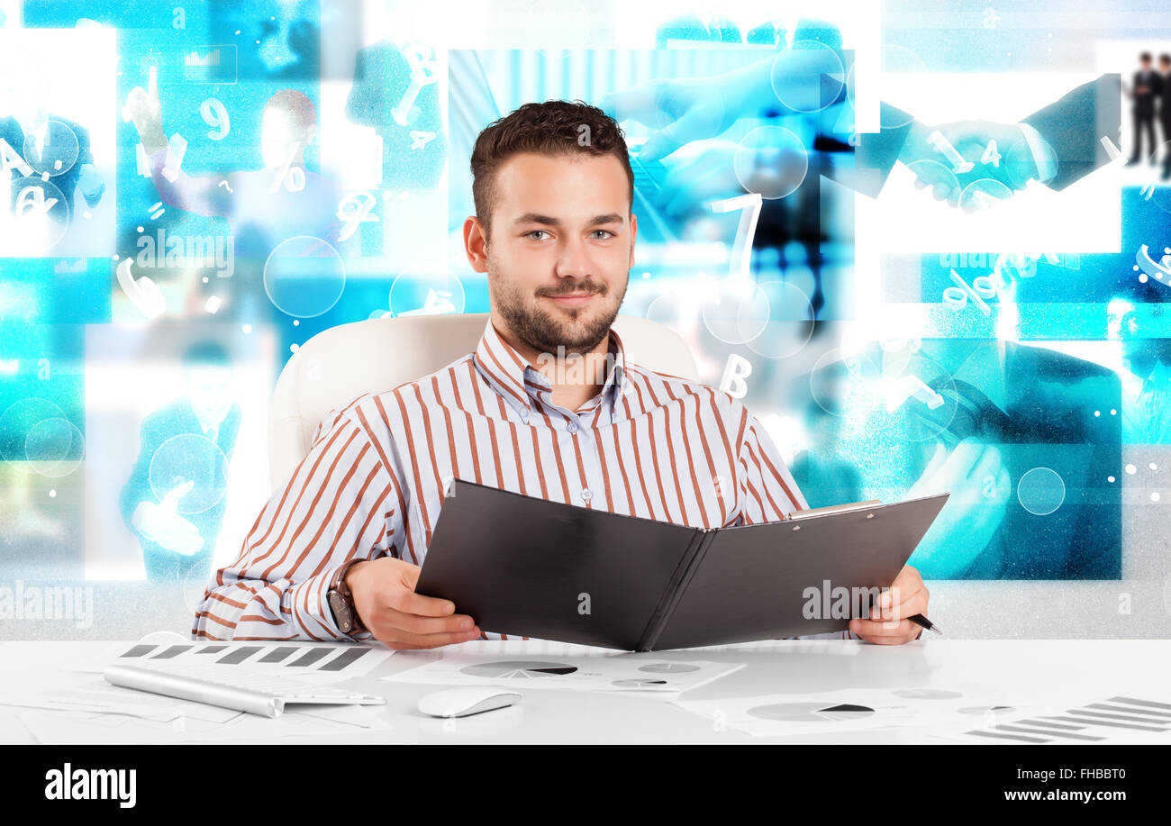 Business person at desk with modern tech images at background Stock ...