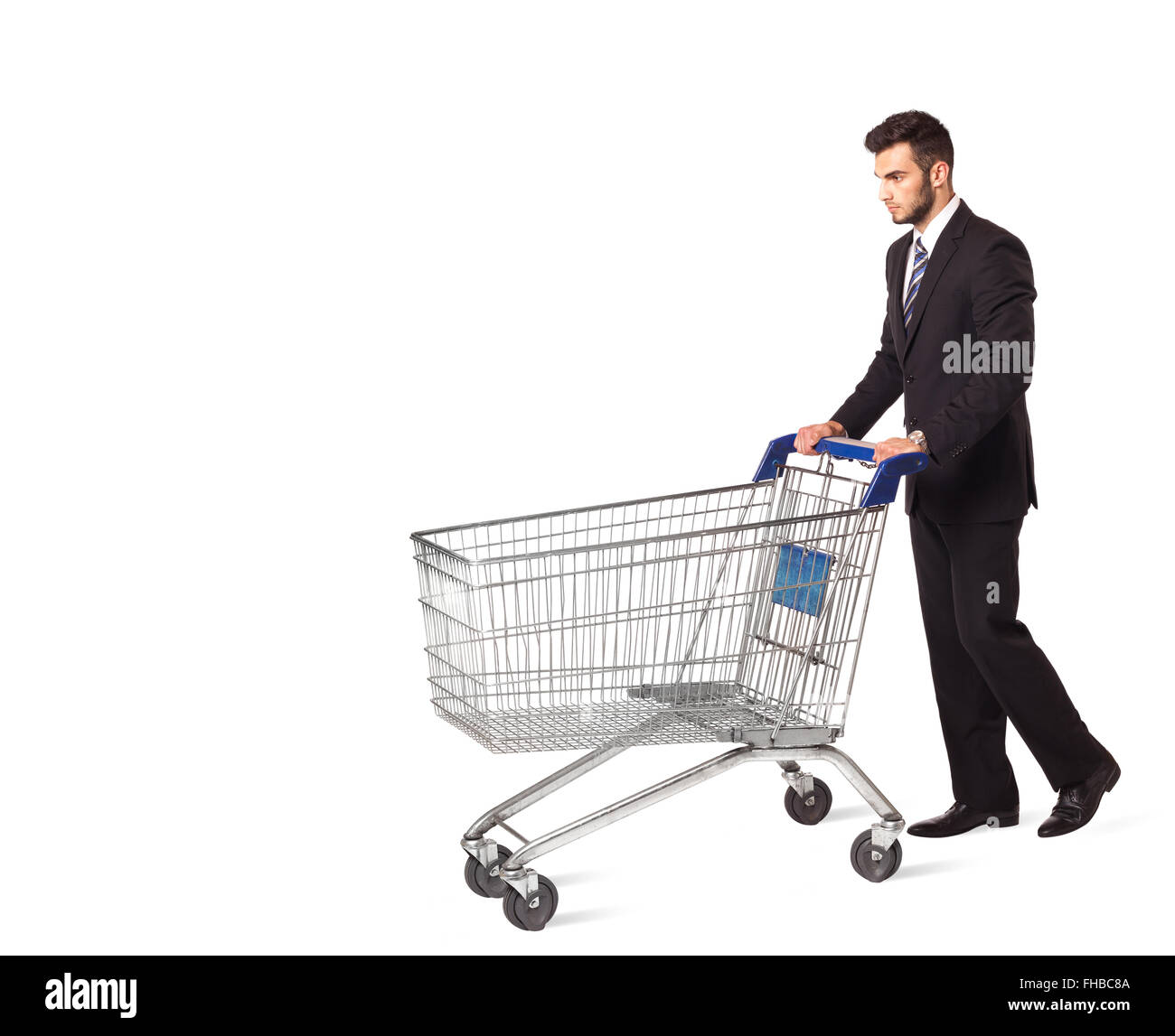 Businessman with shopping cart Stock Photo - Alamy