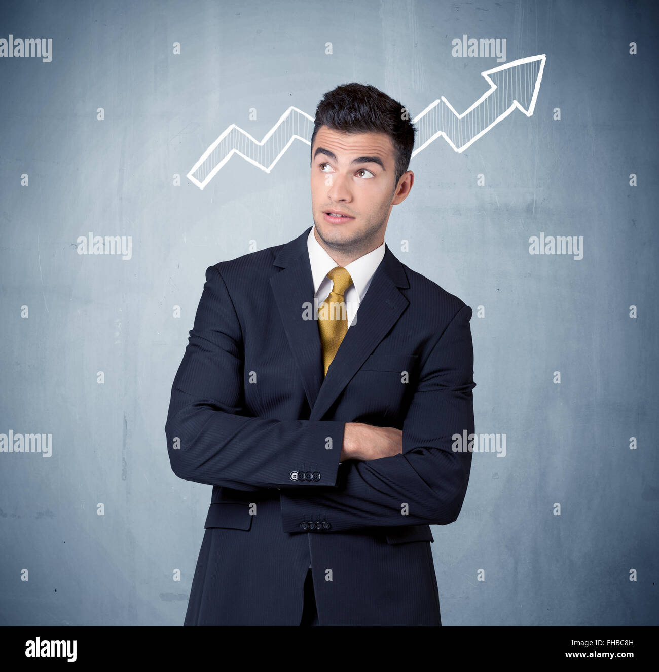 Smiling business guy with graph arrow Stock Photo - Alamy