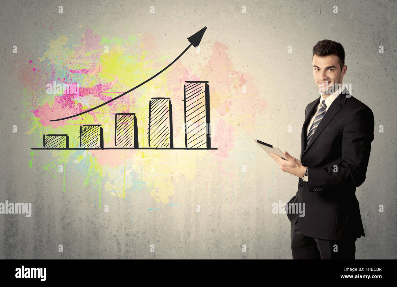 Happy businessman with colorful chart Stock Photo - Alamy
