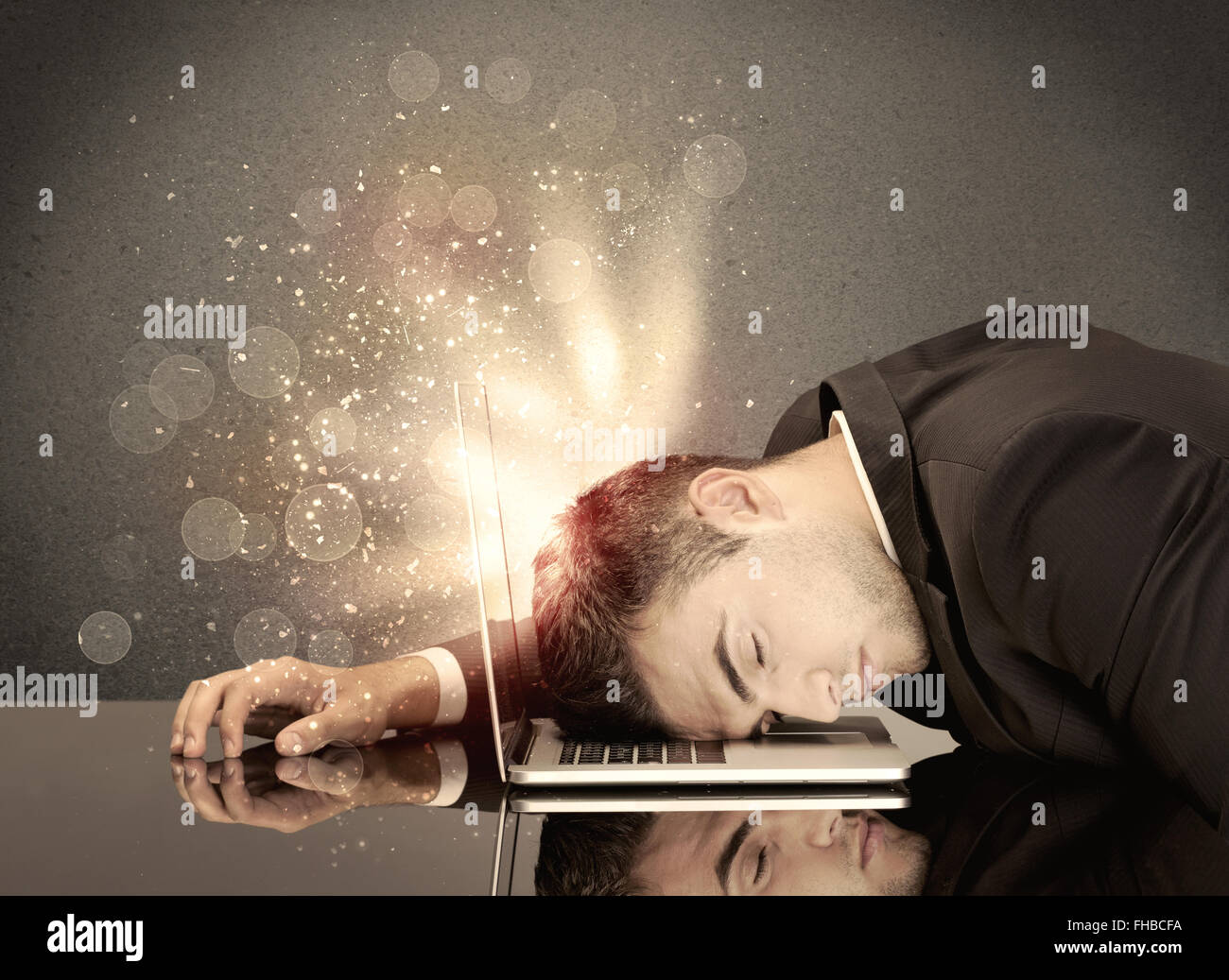 Angry businessman with lights and keyboard Stock Photo - Alamy